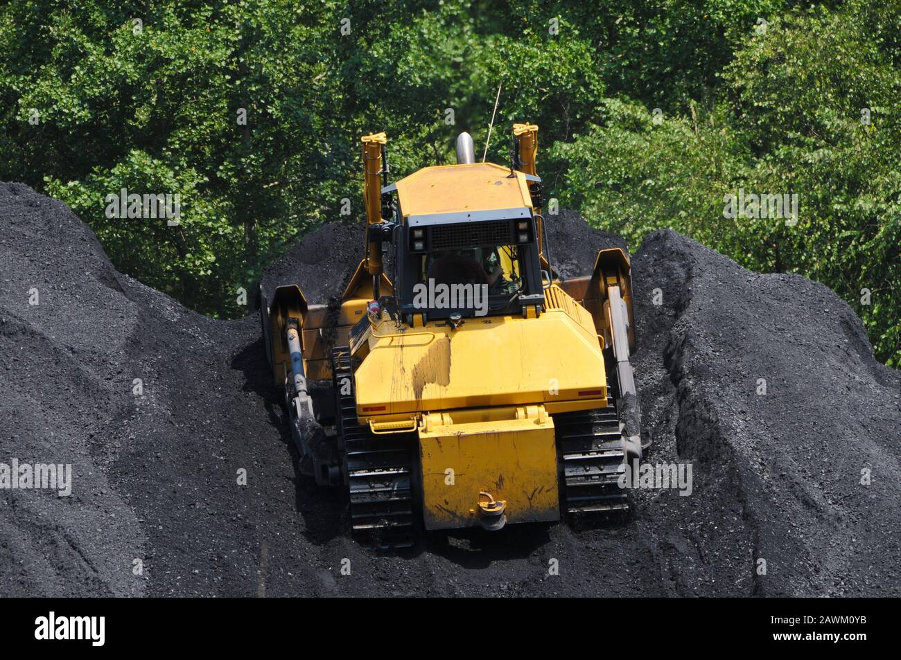 Bulldozer Shoving Large Stockpile of Coal Stock Photo - Alamy
