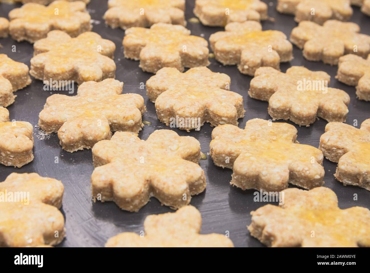 Four-leaf Clover Shaped Raw Cottage Cheese Cookies on Black Baking ...