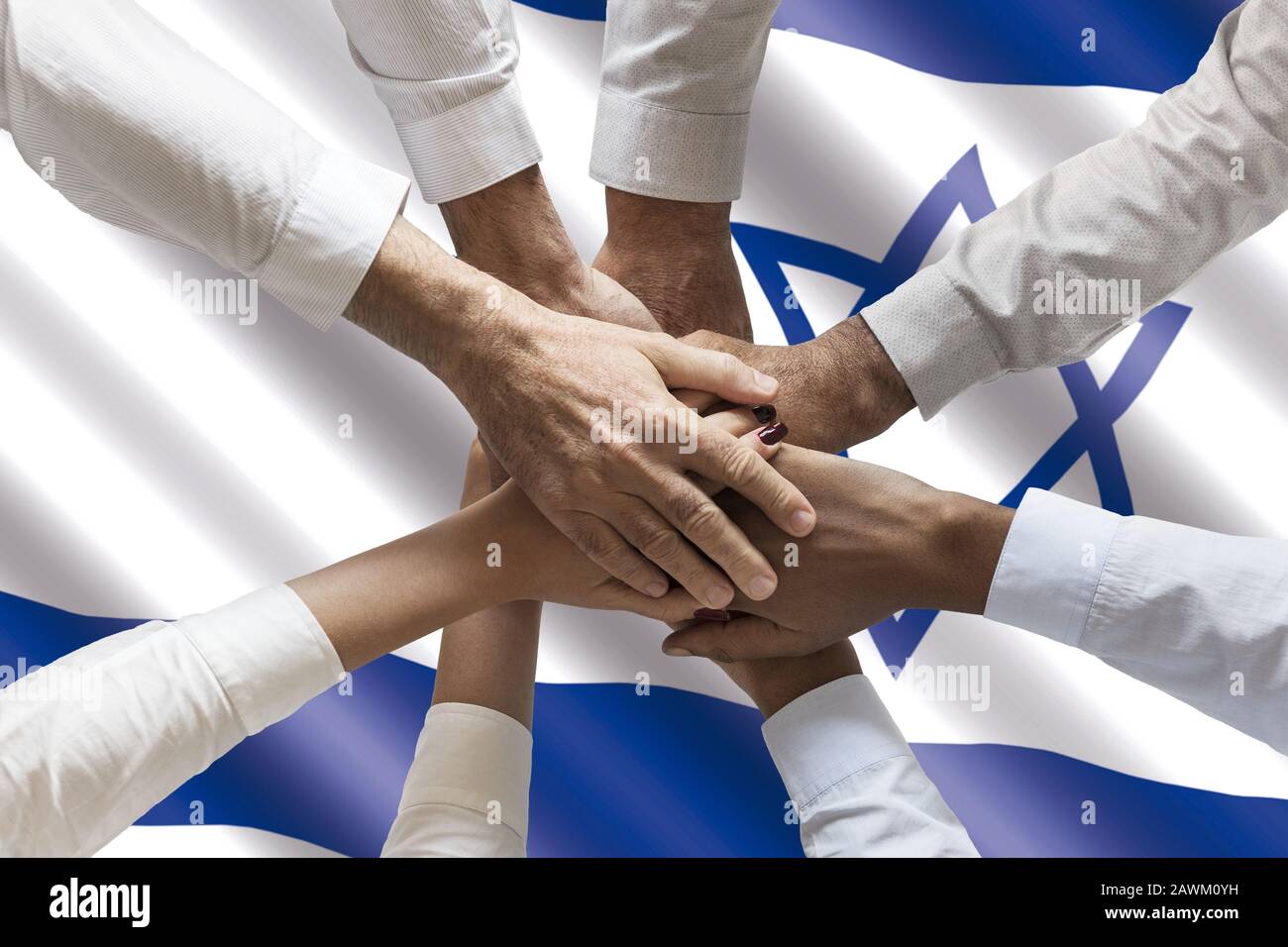 Stack of human hands over waving Israeli flag Stock Photo - Alamy