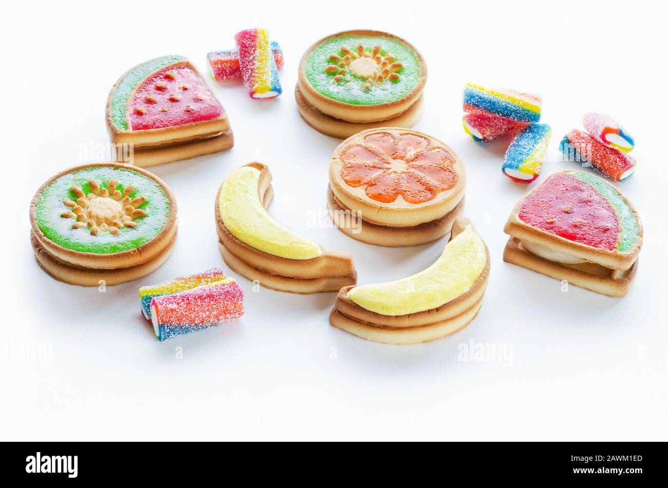 Different types of sweet shortbread cookies with fruit jelly on a white ...