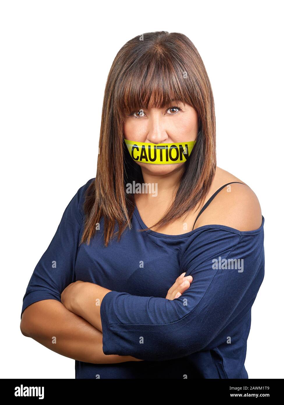 Angry brunette woman arm crossed with yellow caution tape on her mouth ...
