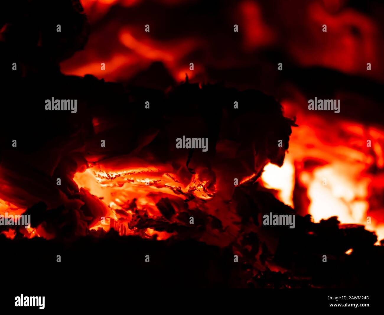 Red heat of charcoal burning wood in the dark. Fire. Background image ...
