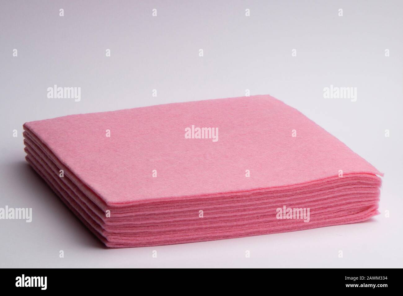 Pink microfiber cloths in a stack on a white background. Housewares ...
