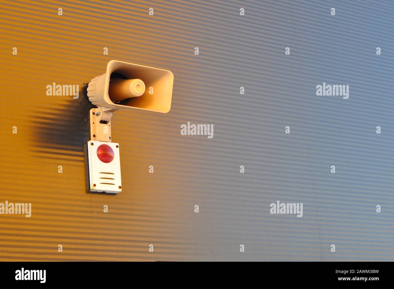 Megaphone for signaling in case of fire on the wall of a warehouse ...