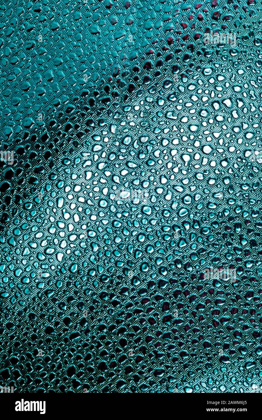 Macro view of bumpy blue-silver fabric surface with metallic effect ...