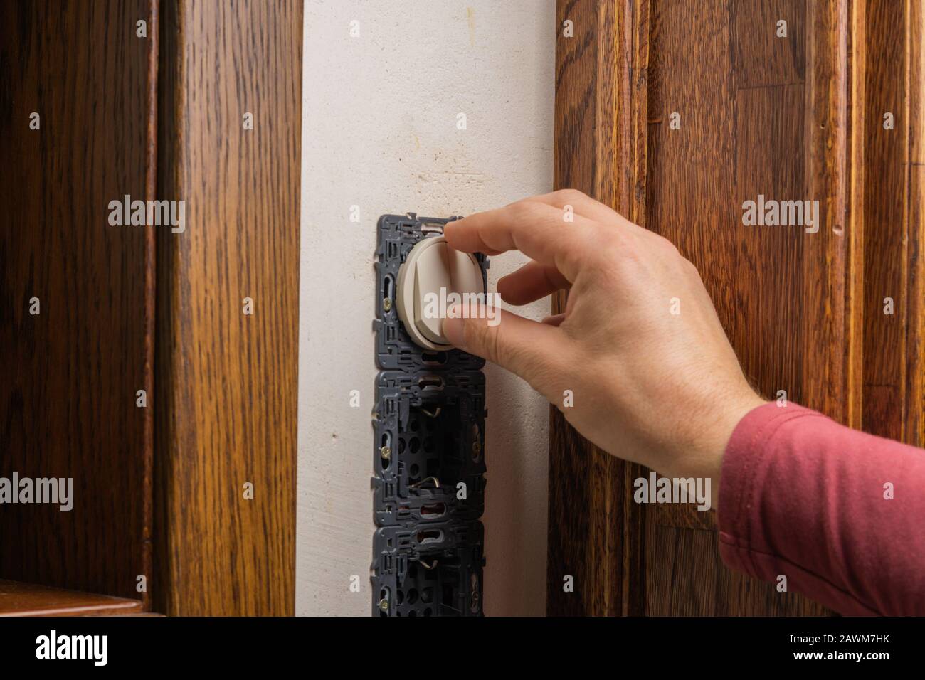 Socket Installation. A master electrician installs an electrical ...