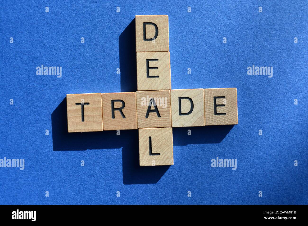 Trade Deal in 3d wooden alphabet letters on a blue background Stock ...