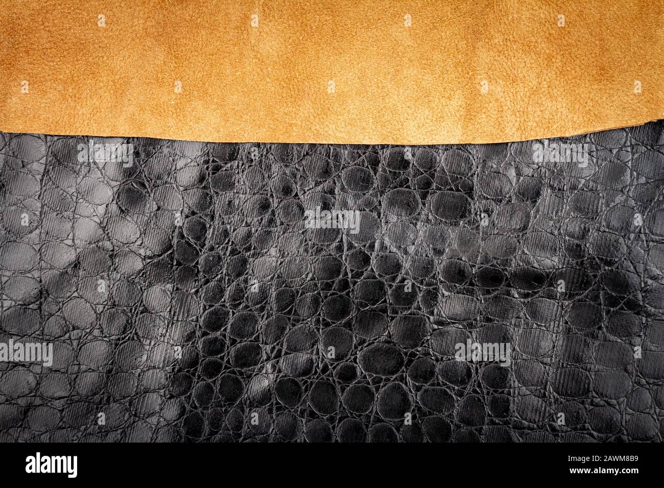 Brown leather and black artificial alligator skin textures background ...