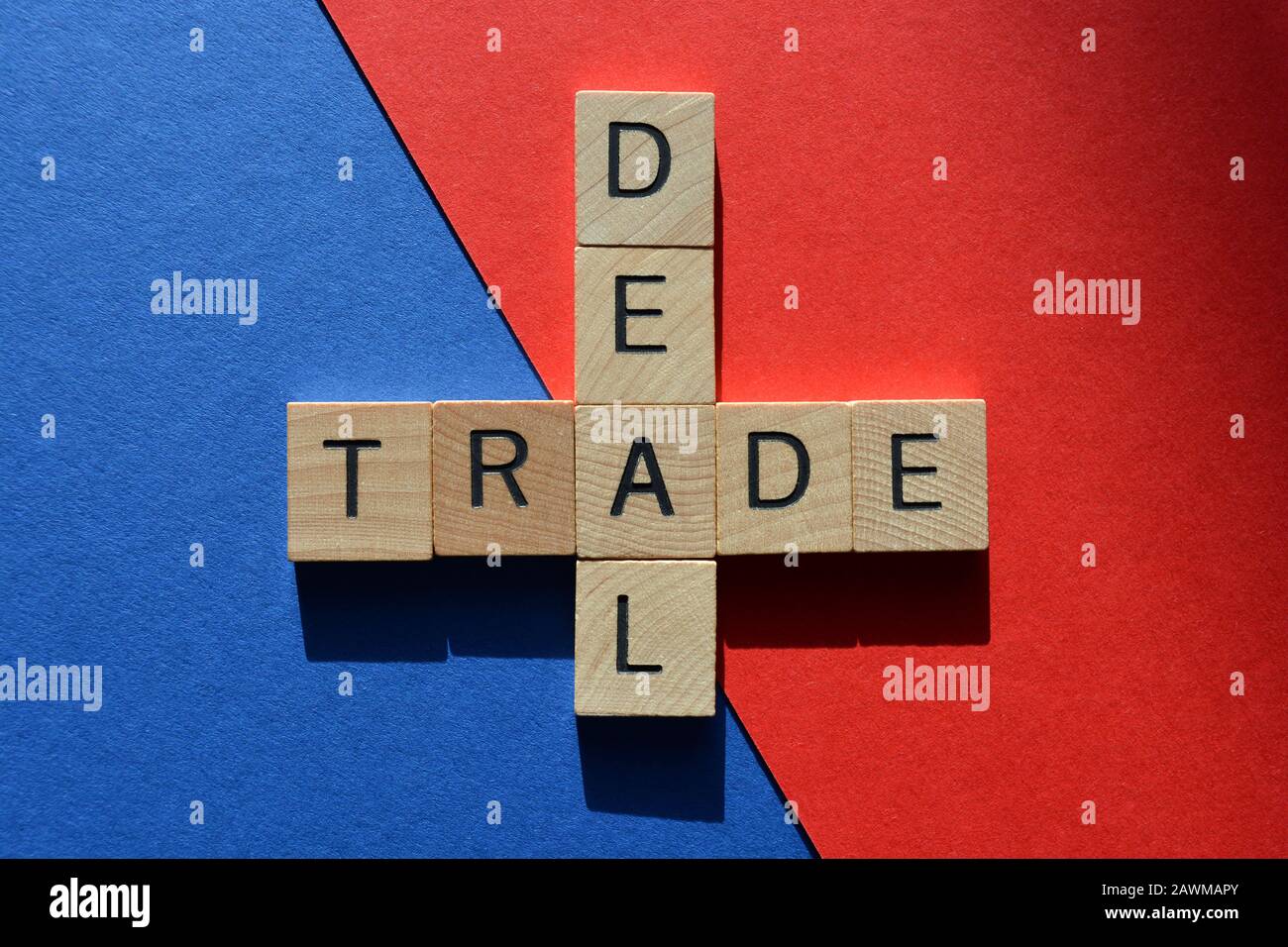 Trade Deal in 3d wooden alphabet letters on a blue and red background ...