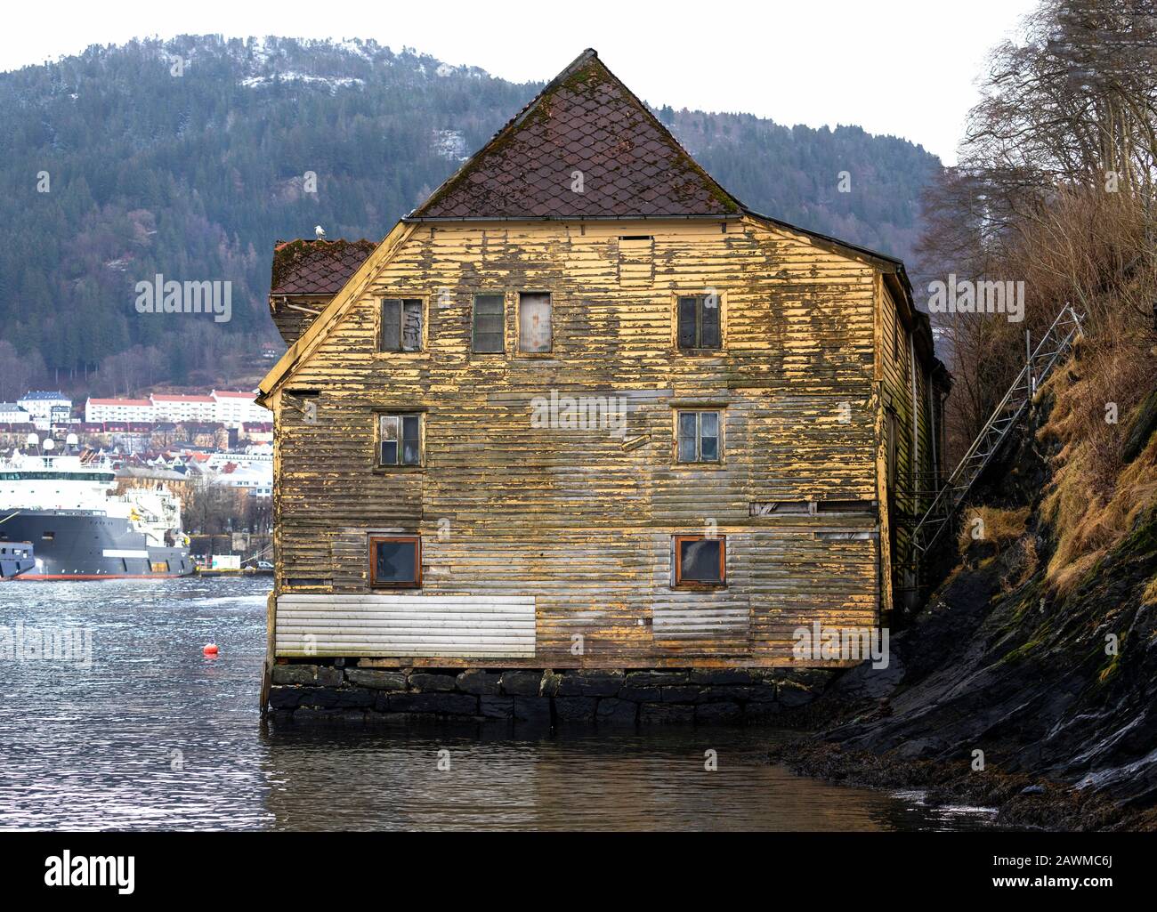 Old, decaying building at Nordnes Peninsular, port of Bergen, Norway ...