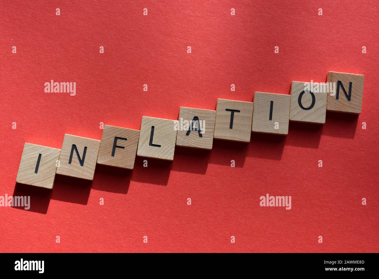 Inflation in 3D wooden alphabet letters on a red background Stock Photo ...