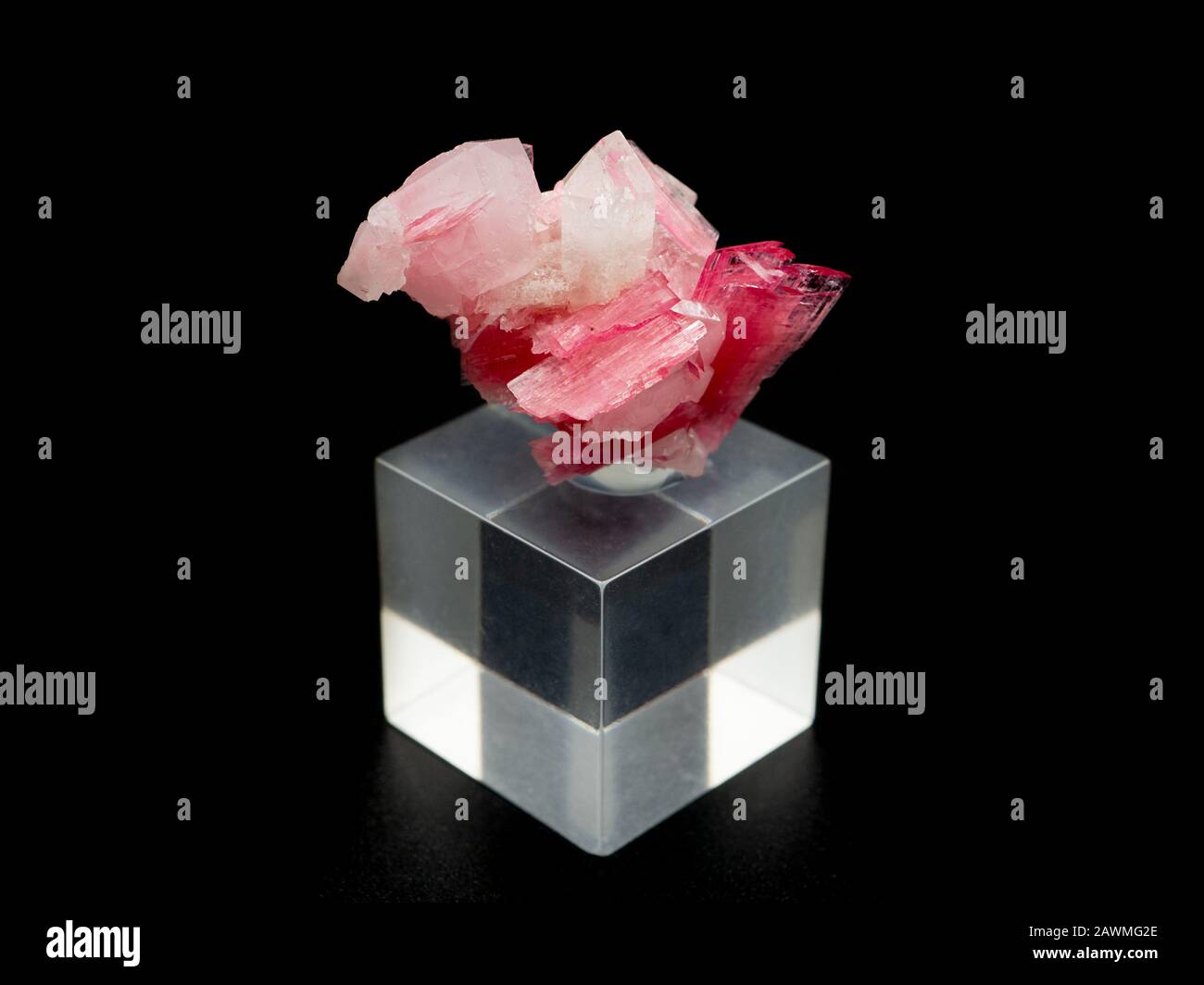 pink rhodonite mineral on black background Stock Photo - Alamy