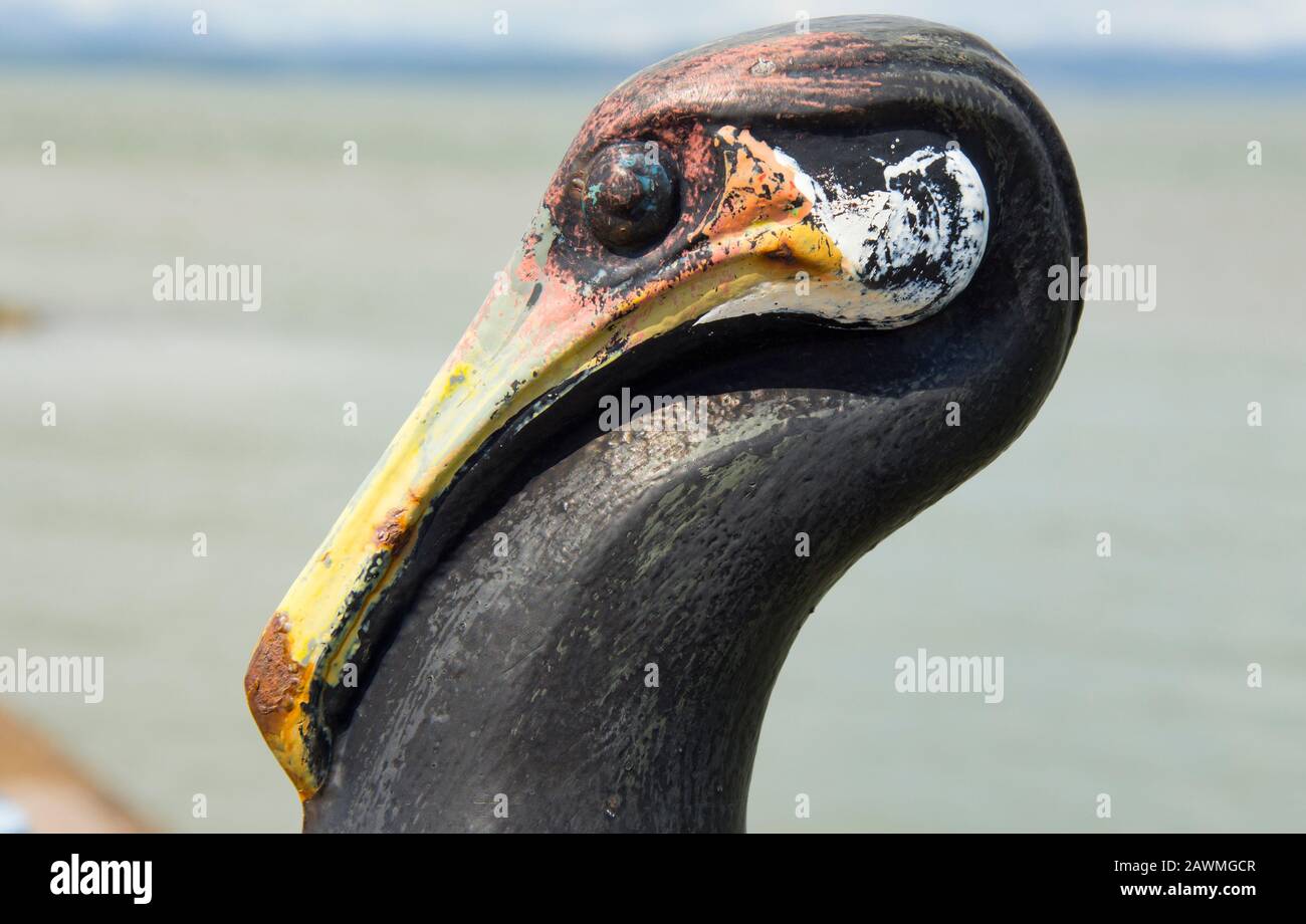 A metal Cormorant sculpture on the promenade at Morecambe in Lancashire ...