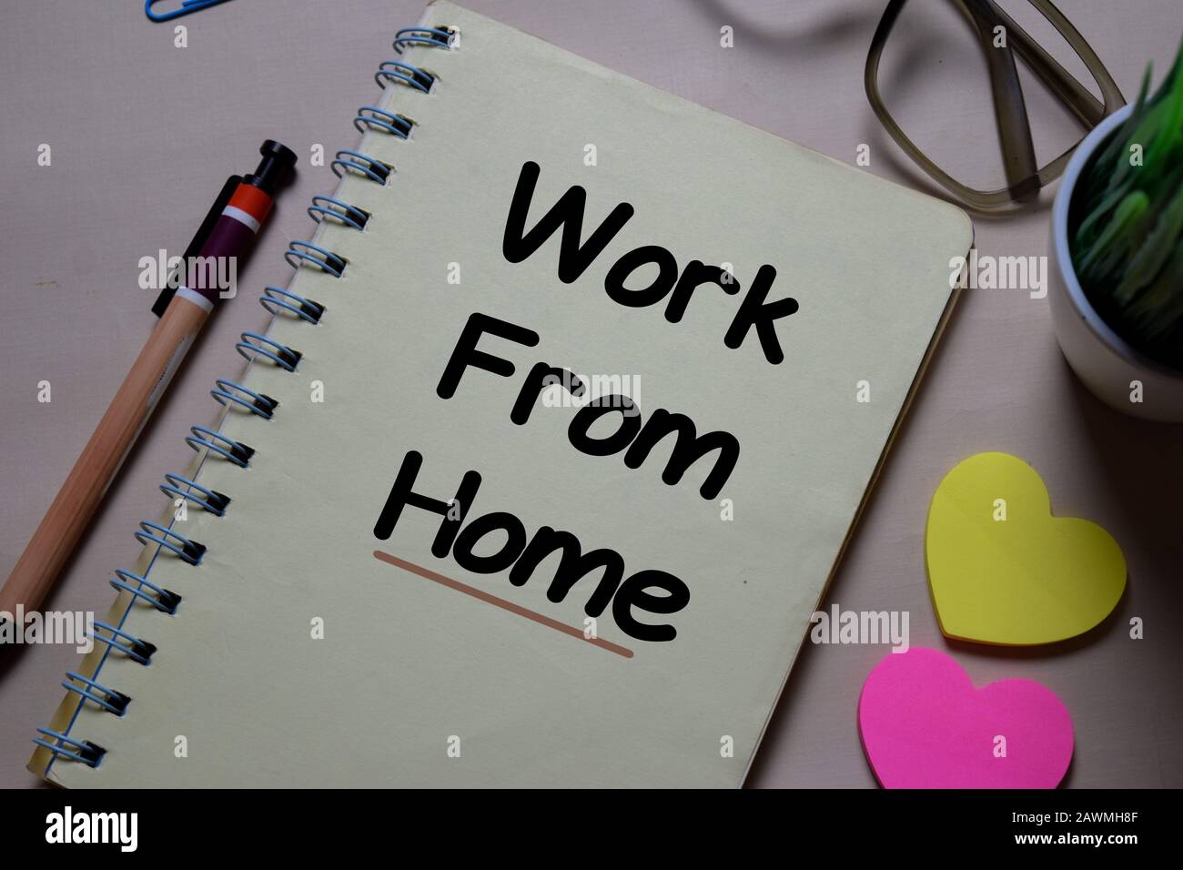 Work from home write on a book isolated on Office Desk Stock Photo - Alamy
