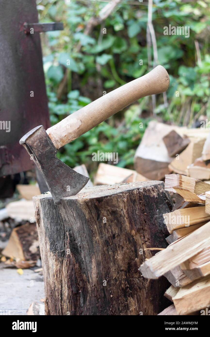 axe stuck in wood stump Stock Photo - Alamy