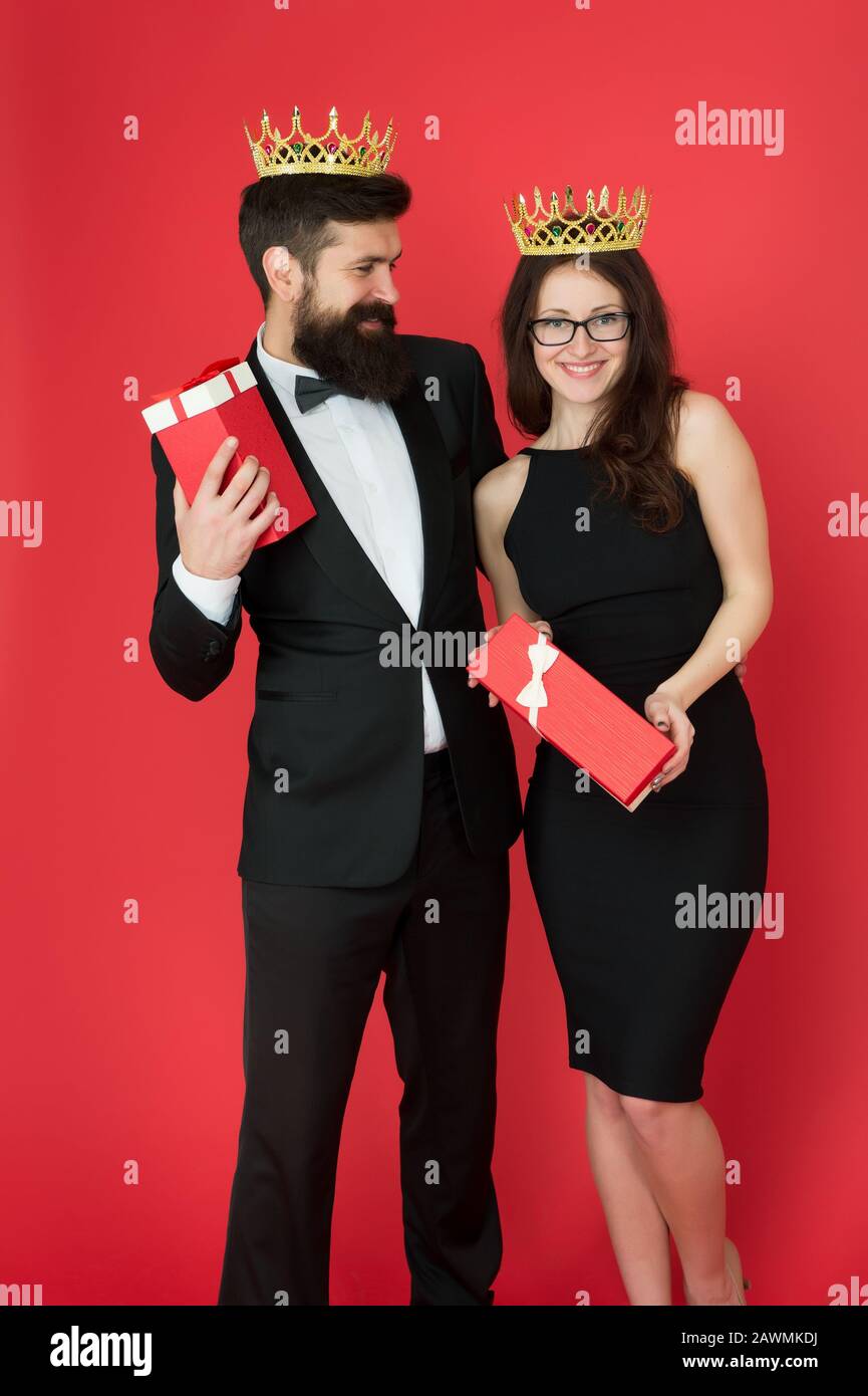 Beautiful people celebrate success. Couple in love wear crowns red ...