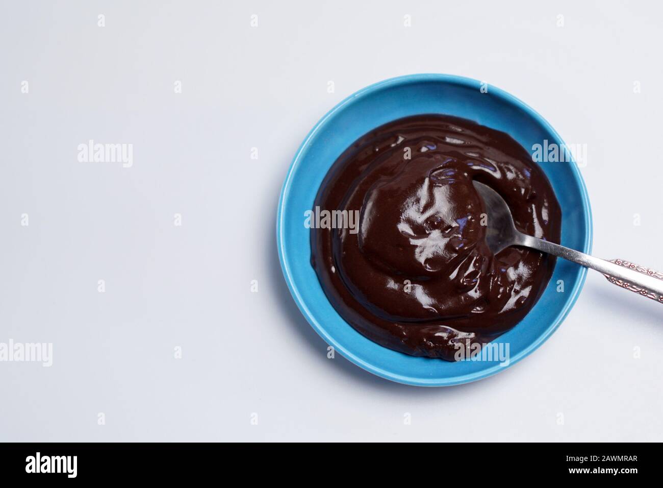 Chocolate pudding in a blue bowl Stock Photo - Alamy