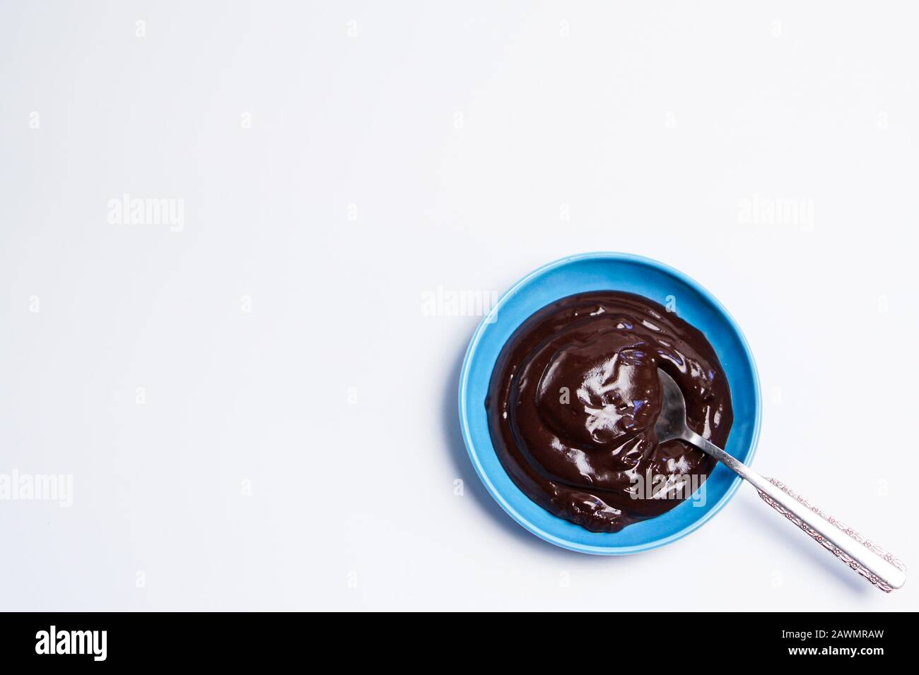 Chocolate pudding in a blue bowl Stock Photo - Alamy