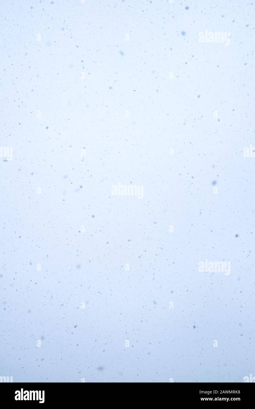 Winter sky with falling snow Stock Photo - Alamy