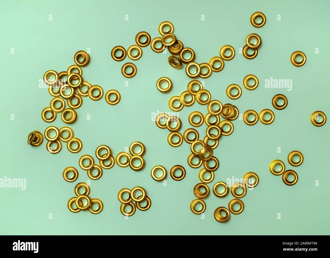 a collection of gold eyelet on a textured papper Stock Photo - Alamy