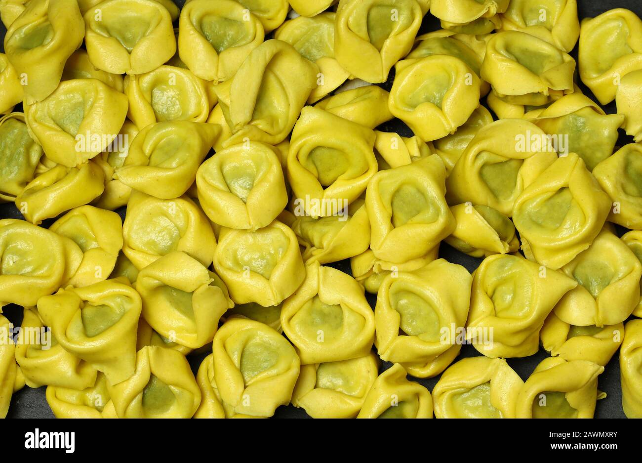 Concept of italian food. Background with fresh tortellini. Top view ...