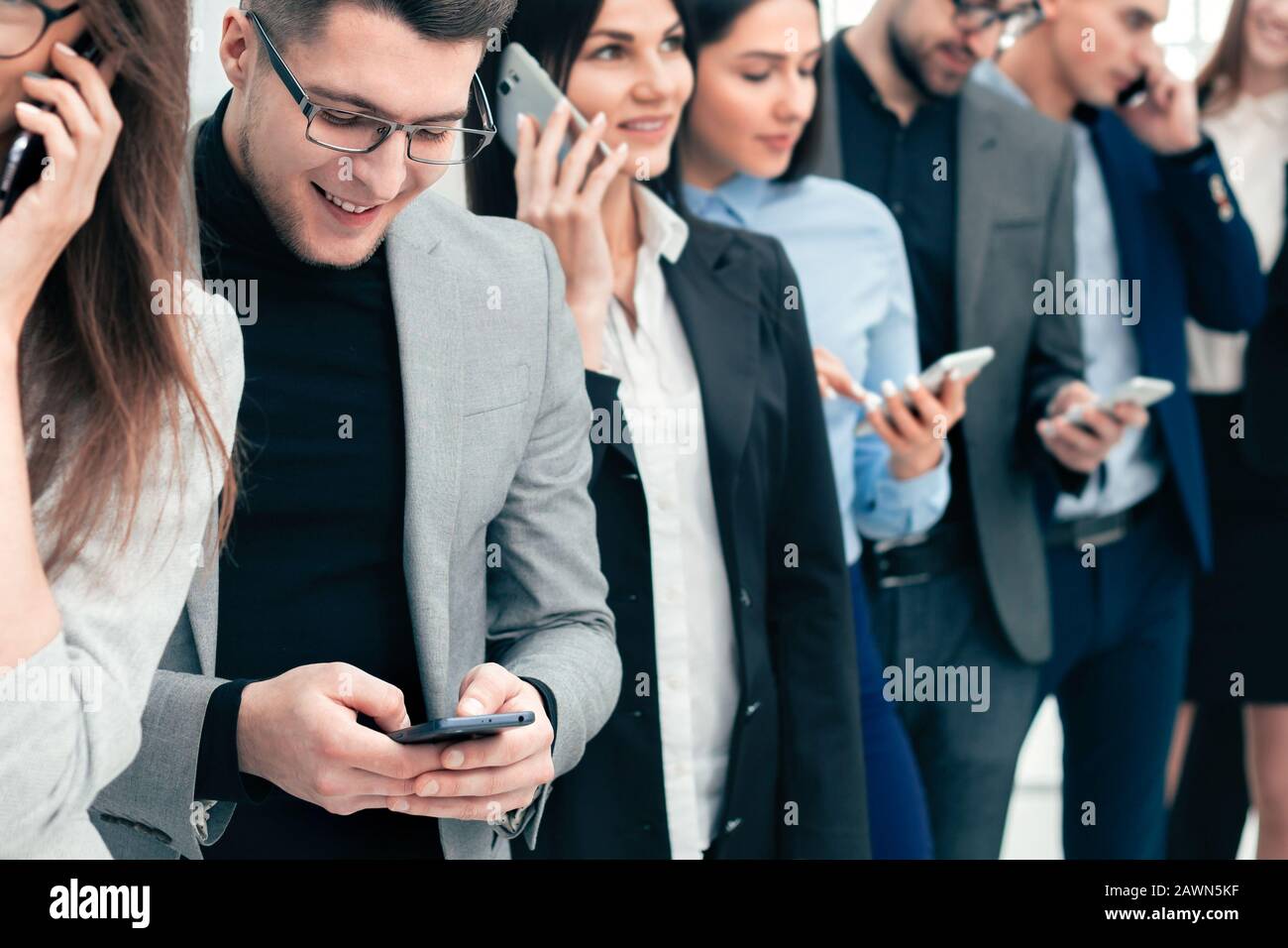 group of diverse young people use their smartphones Stock Photo - Alamy