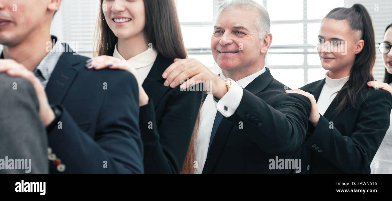 Manager standing behind employees hi-res stock photography and images ...