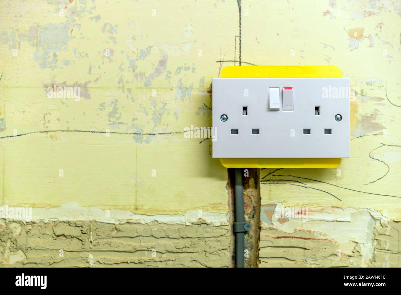 electric socket in a wall during renovation in england uk Stock Photo ...