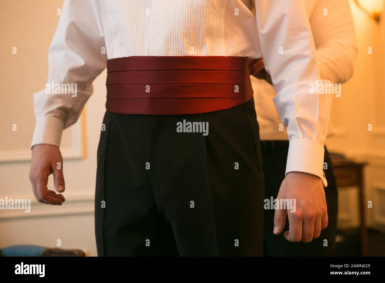 Red cummerbund hi-res stock photography and images - Alamy