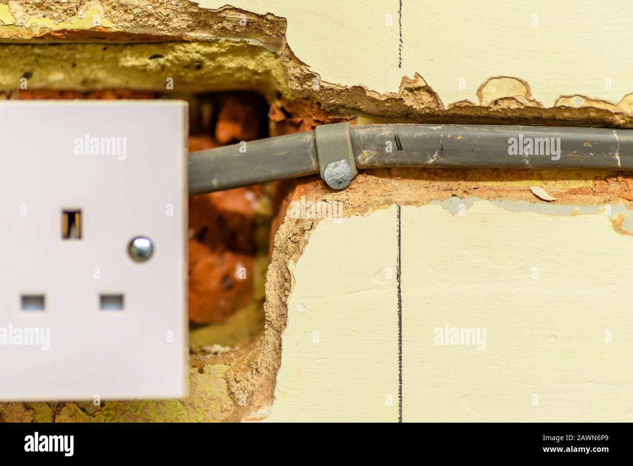 electric socket in a wall during renovation in england uk Stock Photo ...