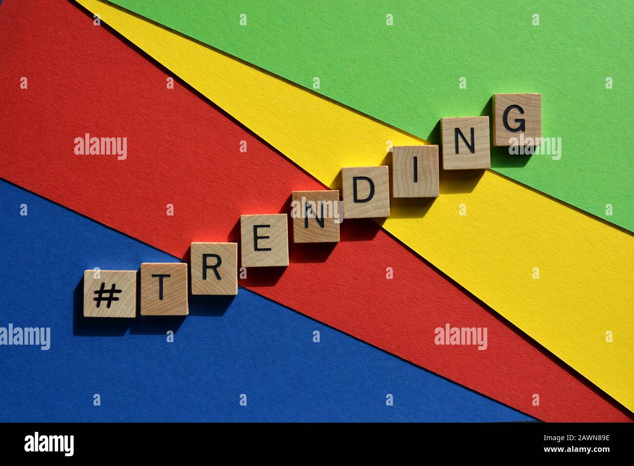 Hash tag symbol and the word trending on multicoloured background Stock ...