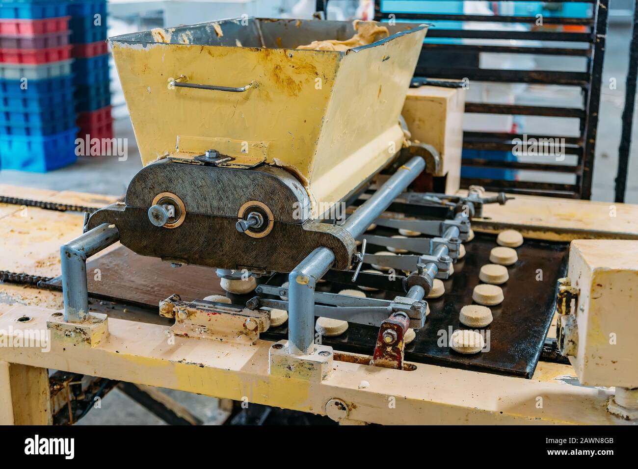 Working cookie forming machine in confectionery factory Stock Photo - Alamy
