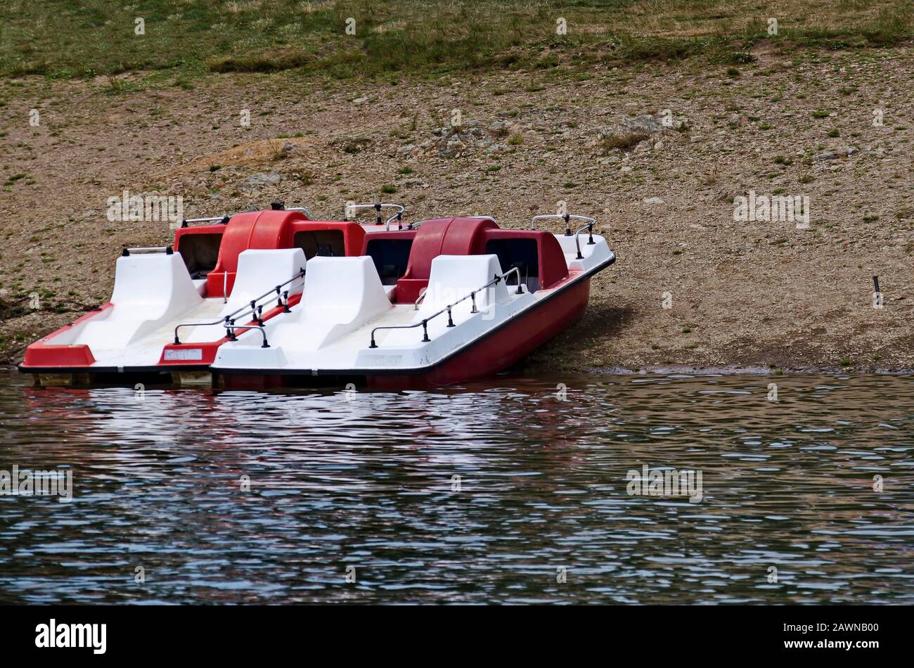 Landscape with mountain, glade, shore and small wharf near artificial ...