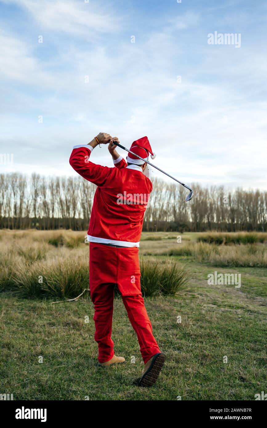 Santa Claus playing golf in the leisure time during daytime Stock Photo ...