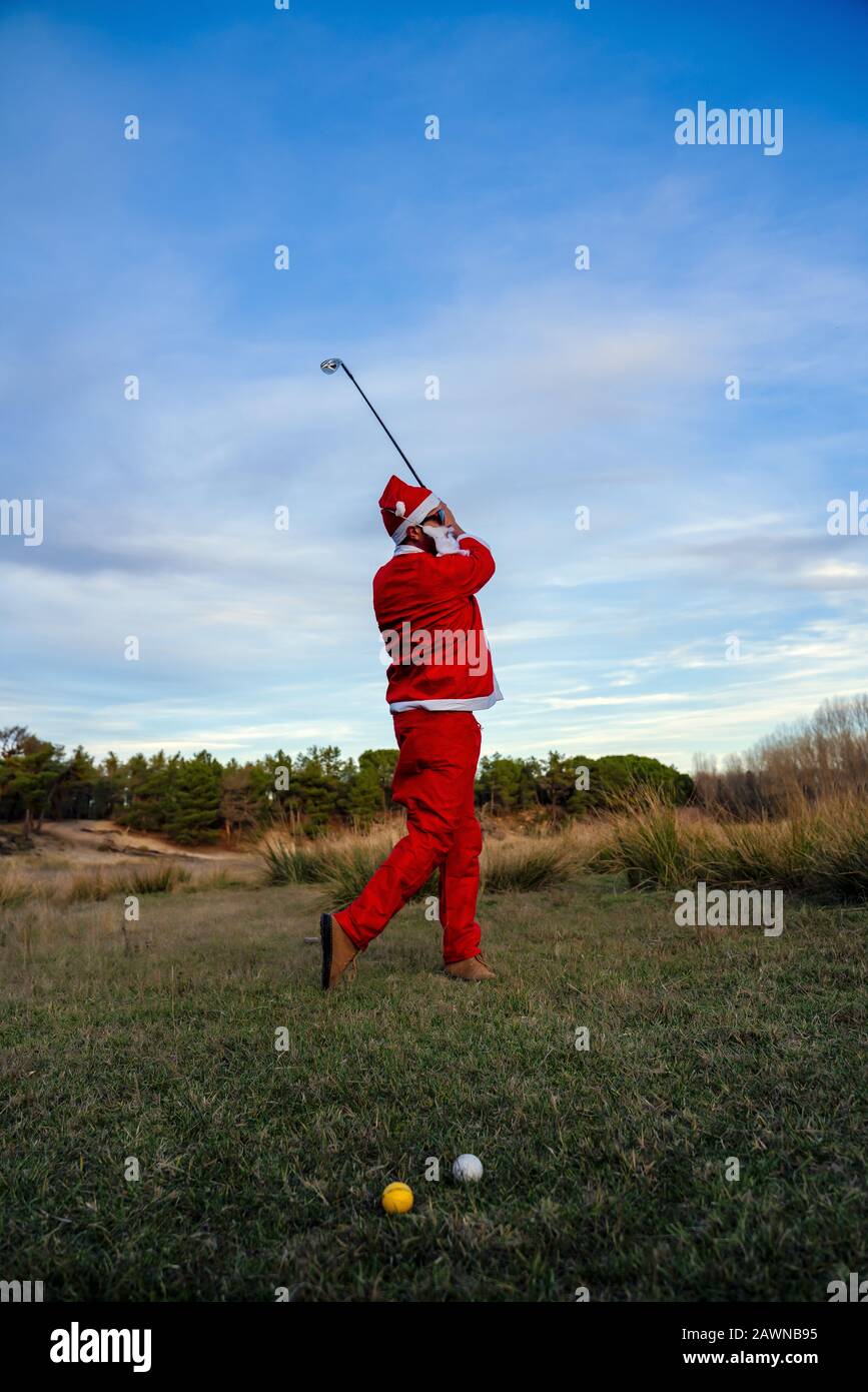 Santa Claus playing golf in the leisure time during daytime Stock Photo ...