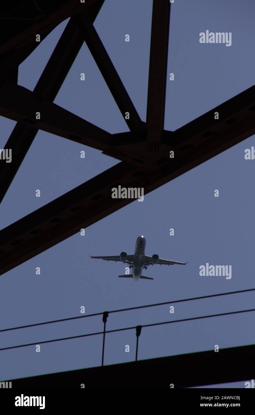 Low angle shot of an airplane flying up high in the sky Stock Photo - Alamy