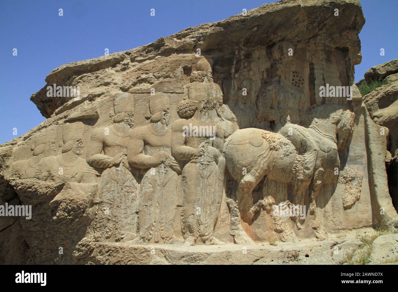 Statue carved on a piece of rock during daytime Stock Photo - Alamy