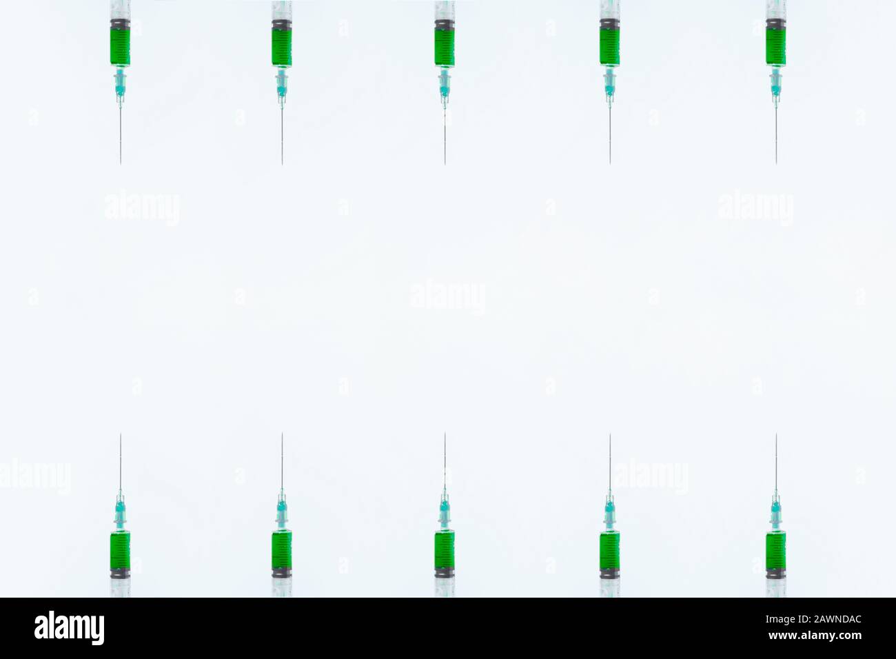 green liquid in a syringes on a blue background, concept of antiviral ...