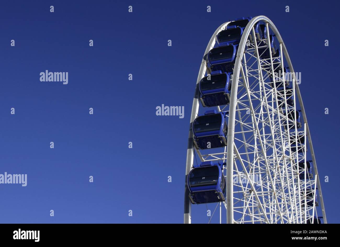 Upper part of a large circular carousel under a blue sky Stock Photo ...
