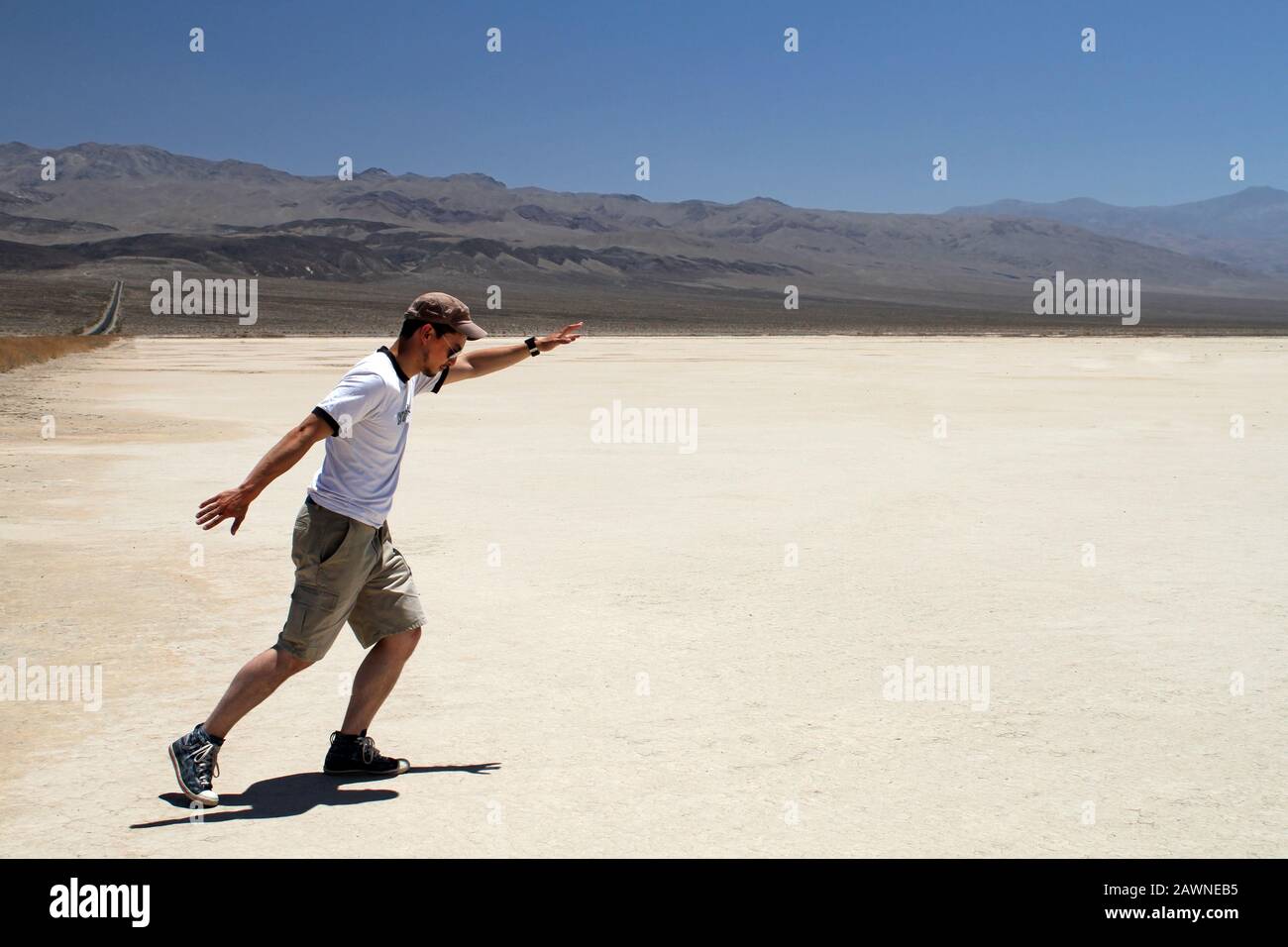 Wide angle shot of a man in the Death Valley National Park in the USA ...