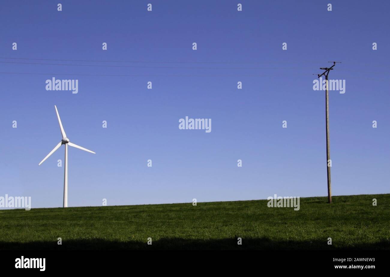 White wind fan under a clear blue sky during daytime Stock Photo - Alamy