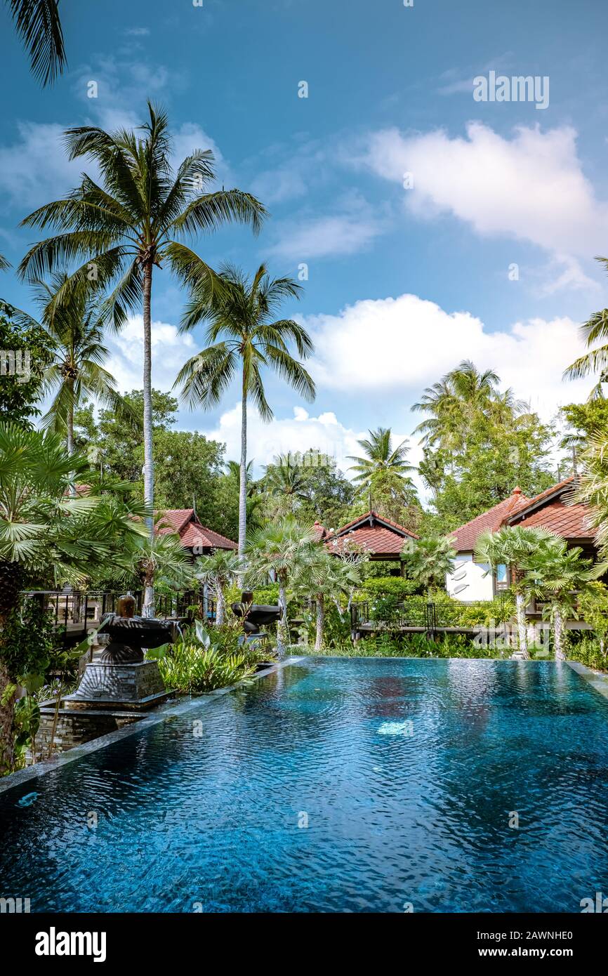 beach with palm tree and swimming pool in Thailand Chumphon area during ...