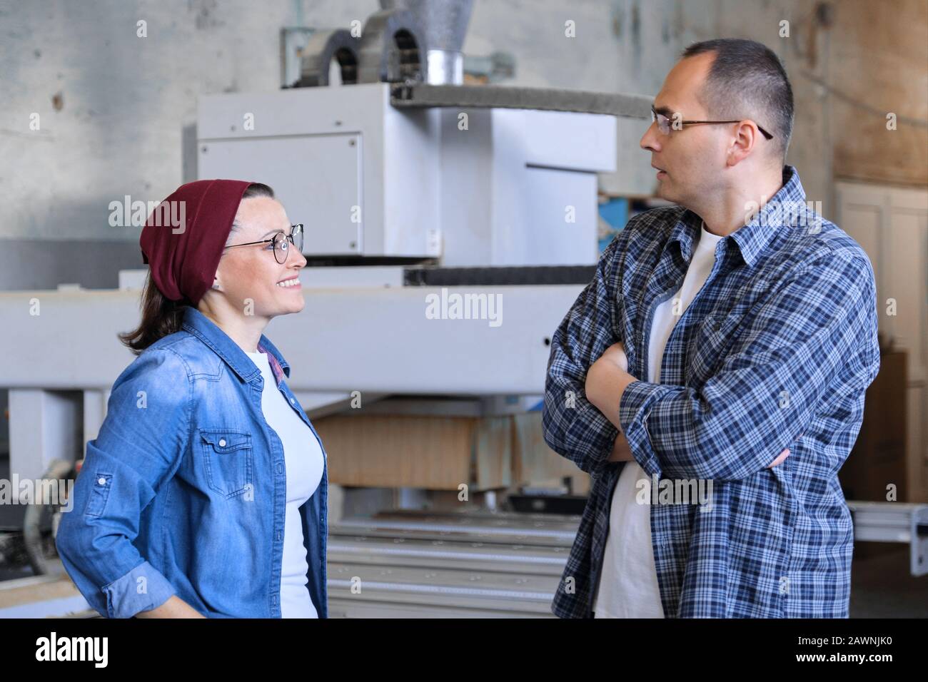 Industrial portrait of two working men and woman Stock Photo - Alamy