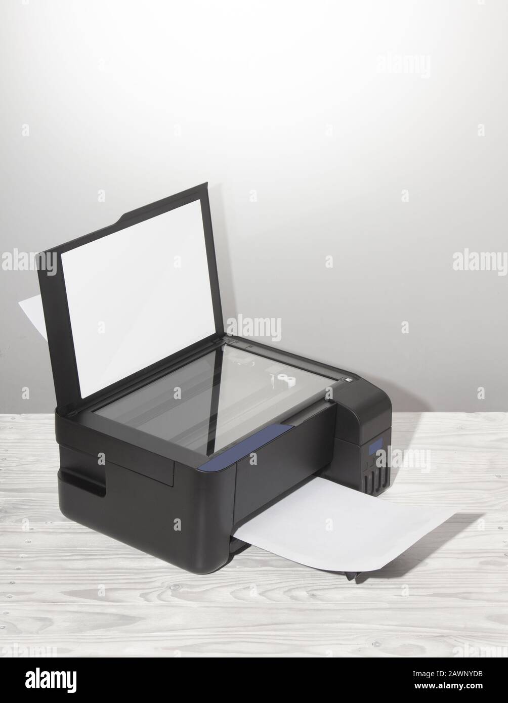 Black copier on white wooden table, closeup Stock Photo - Alamy