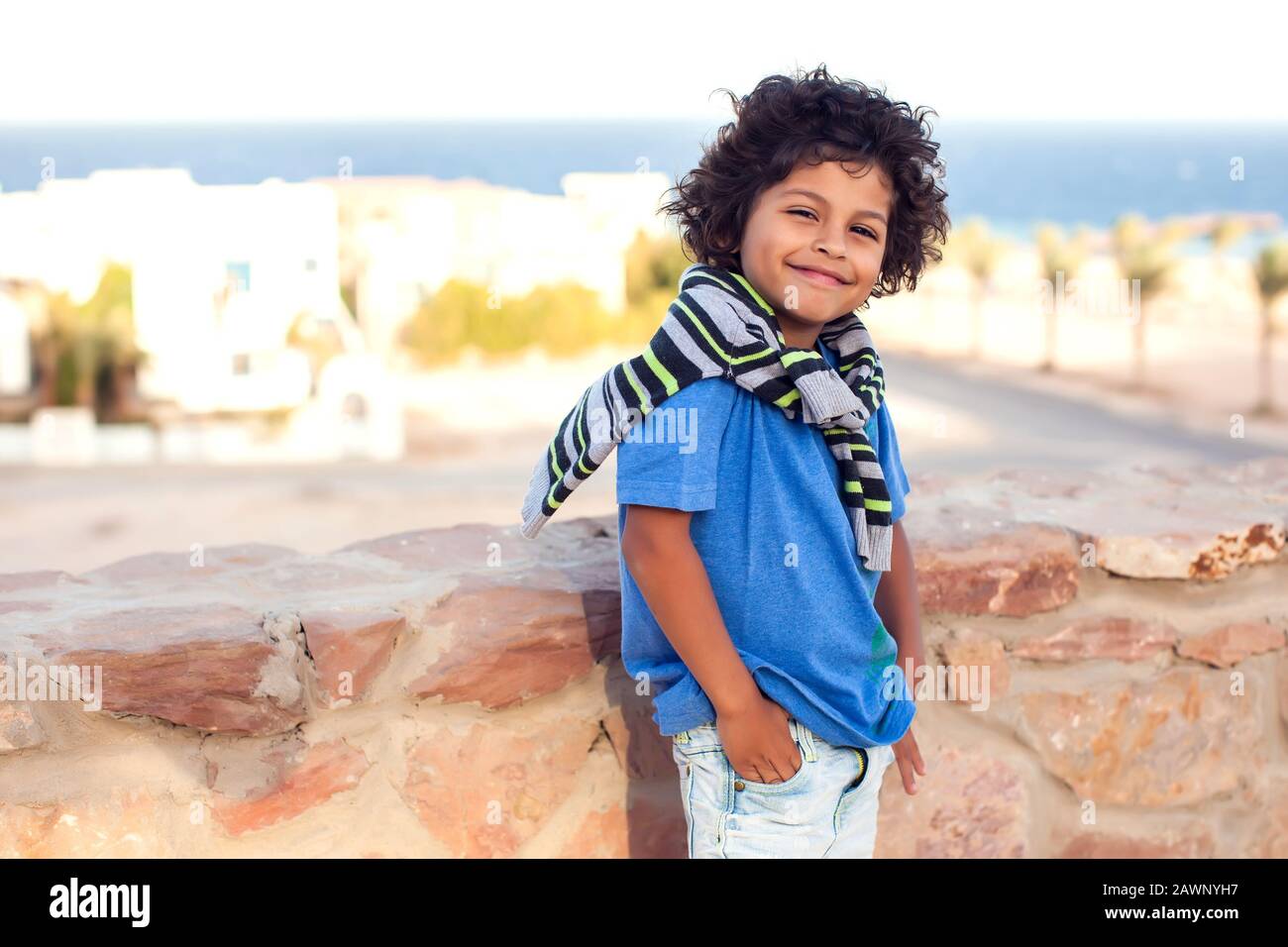 Boy with blue t shirt hi-res stock photography and images - Alamy