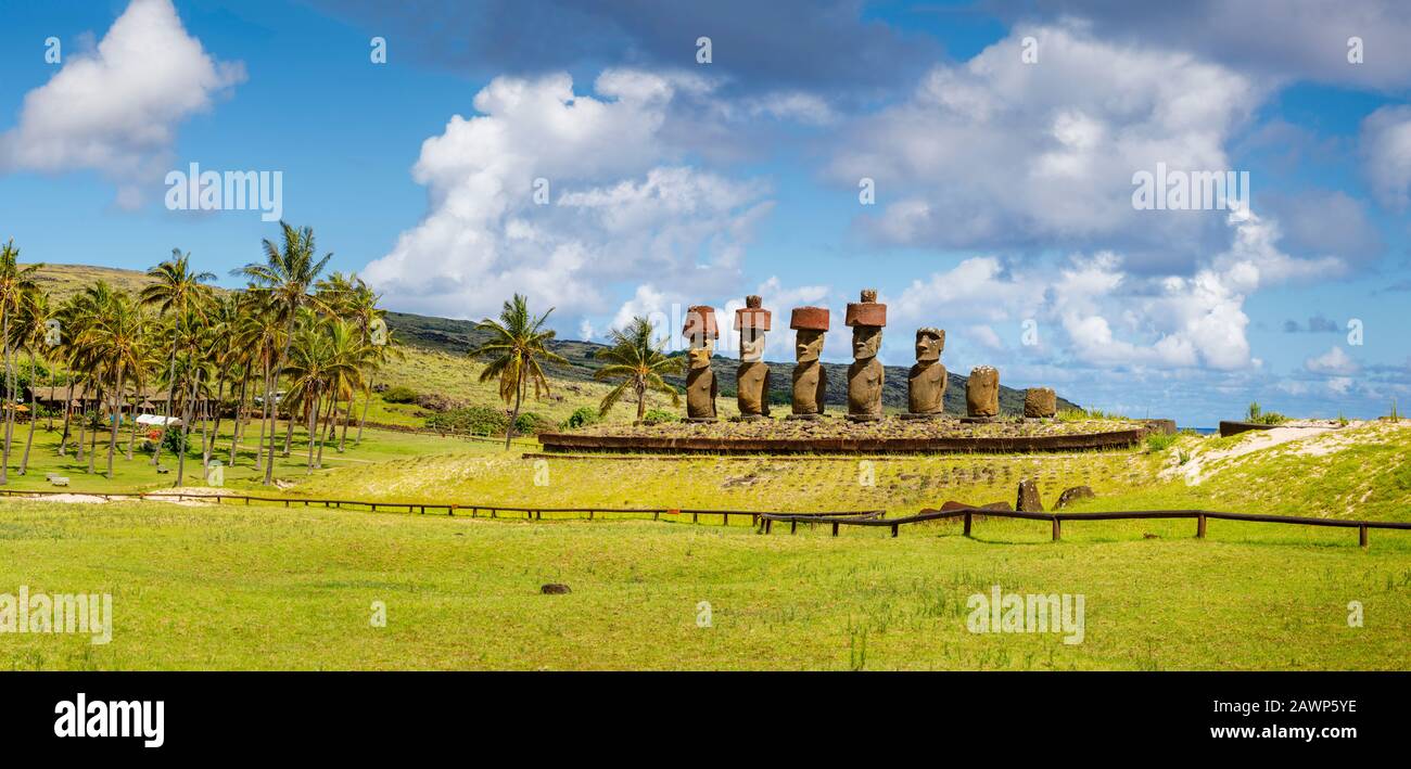 Restored Moai statues with red scoria topknots standing on Ahu Nao-Nao ...