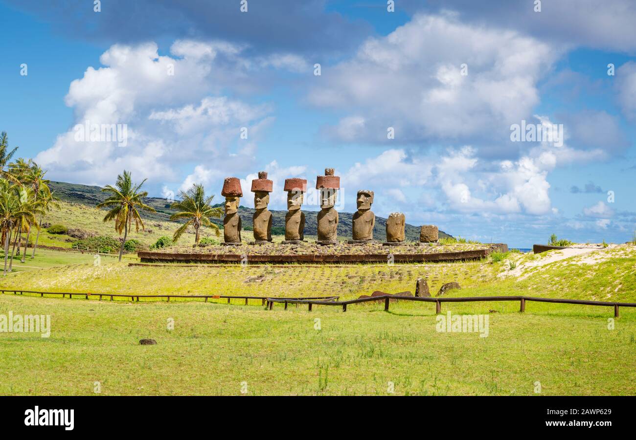 Restored Moai statues with red scoria topknots standing on Ahu Nao-Nao ...