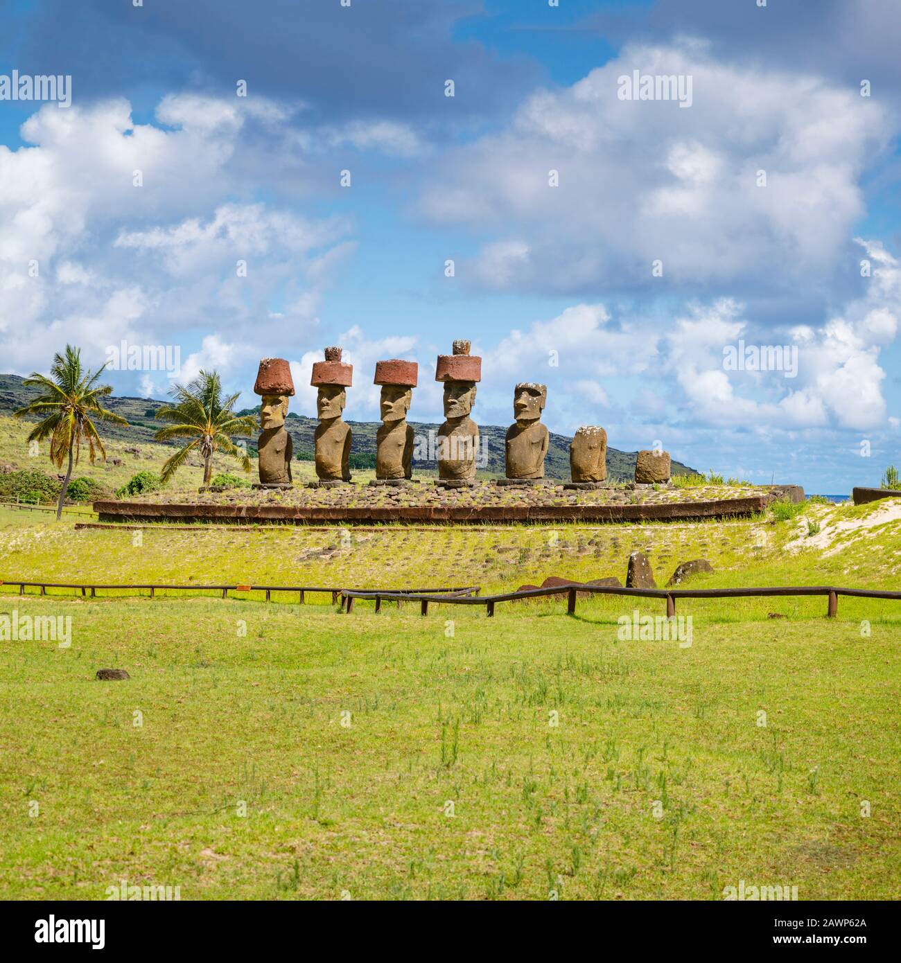 Restored Moai statues with red scoria topknots standing on Ahu Nao-Nao ...