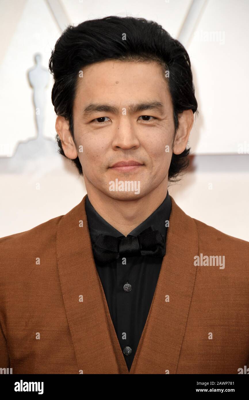 John Cho and his wife actress Kerri Higuchi walking on the red carpet ...