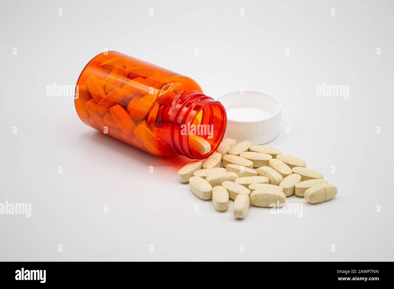 Prescription bottle with generic medicine or vitamin tablets pouring ...